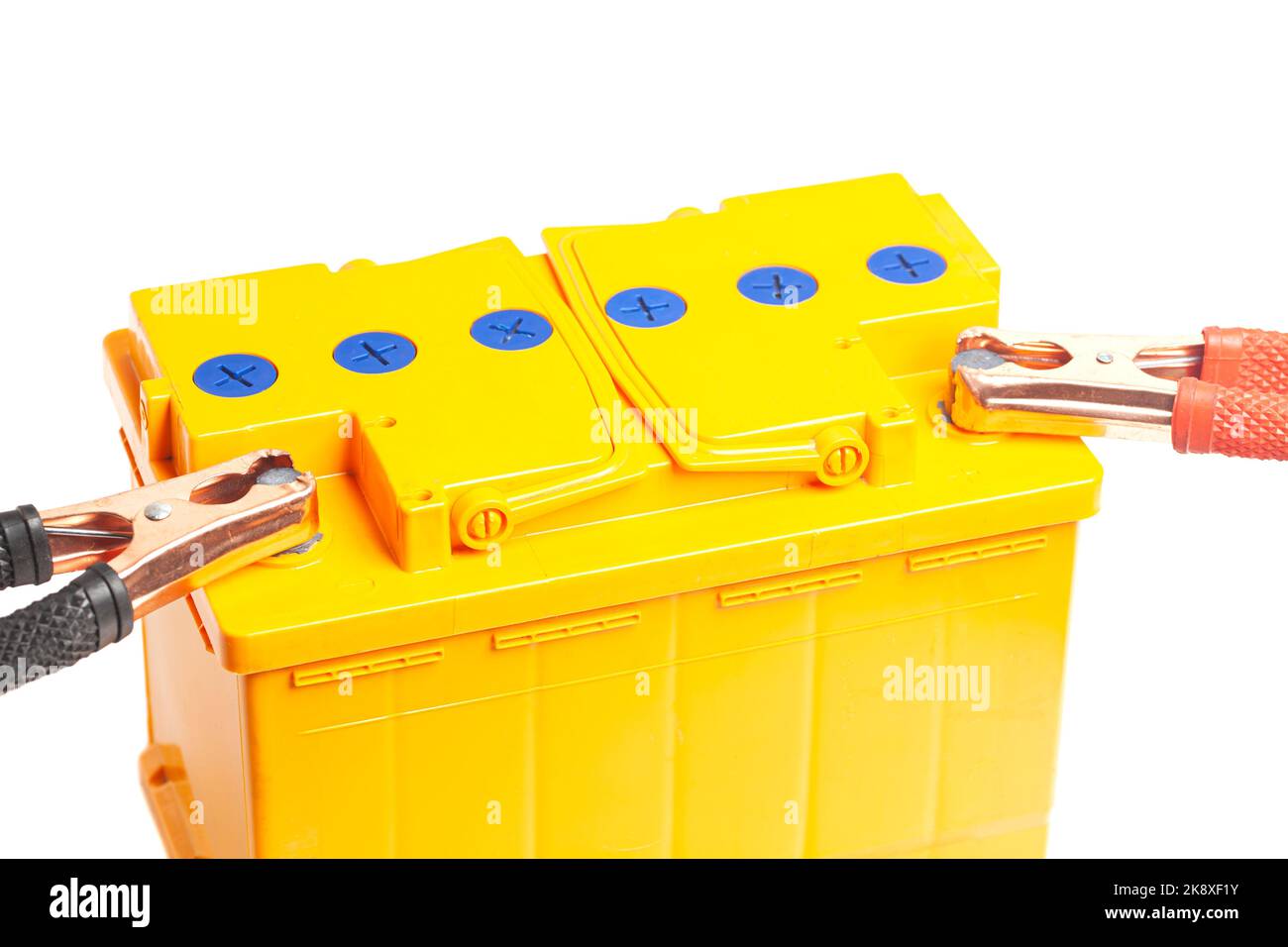 Charging the car acid battery. The charger terminals are connected to ...