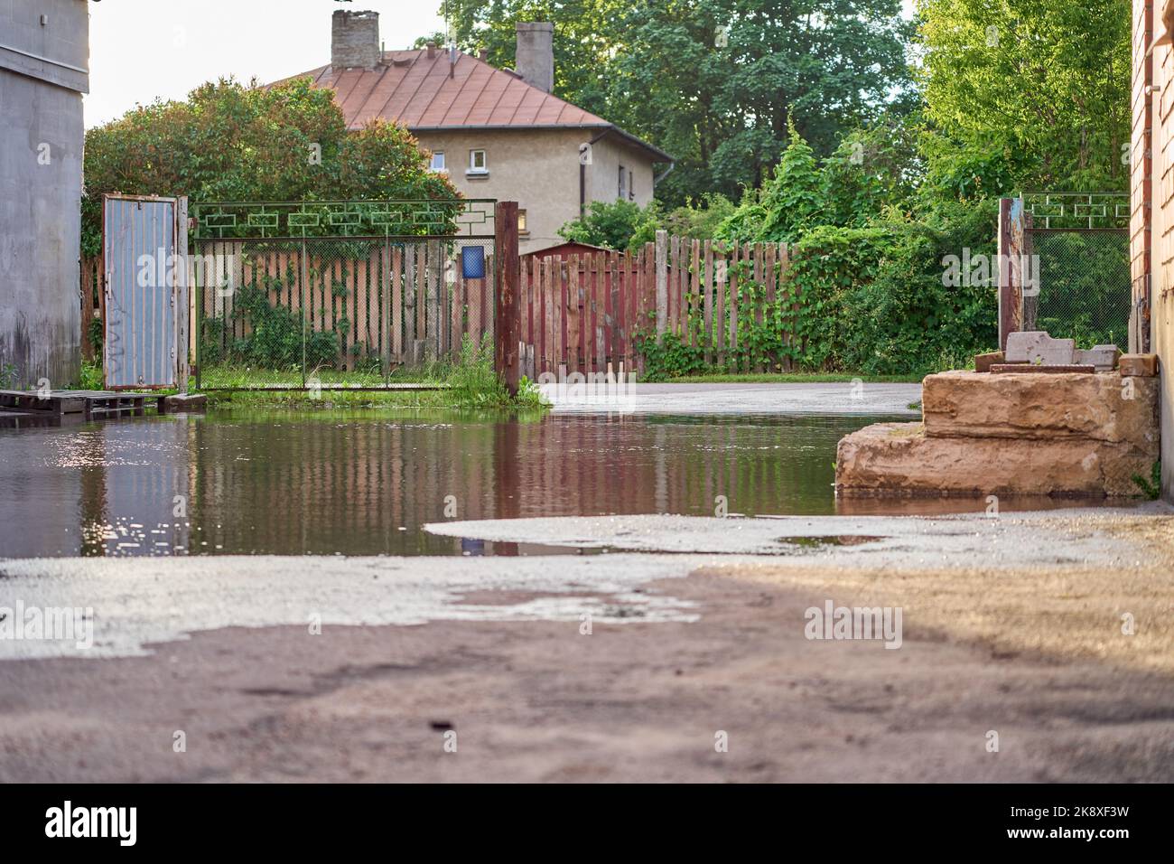 A Giant puddle in the yard Stock Photo - Alamy