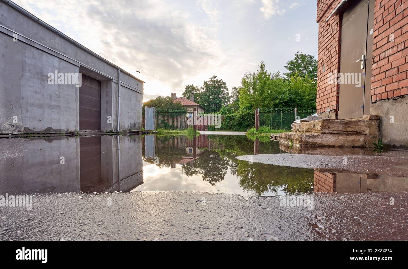 A Giant puddle in the yard Stock Photo - Alamy
