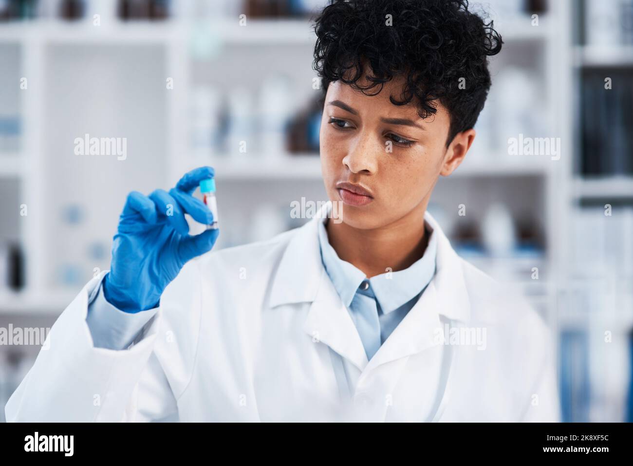 Developing a new cure is her main aim. a young scientist working with ...