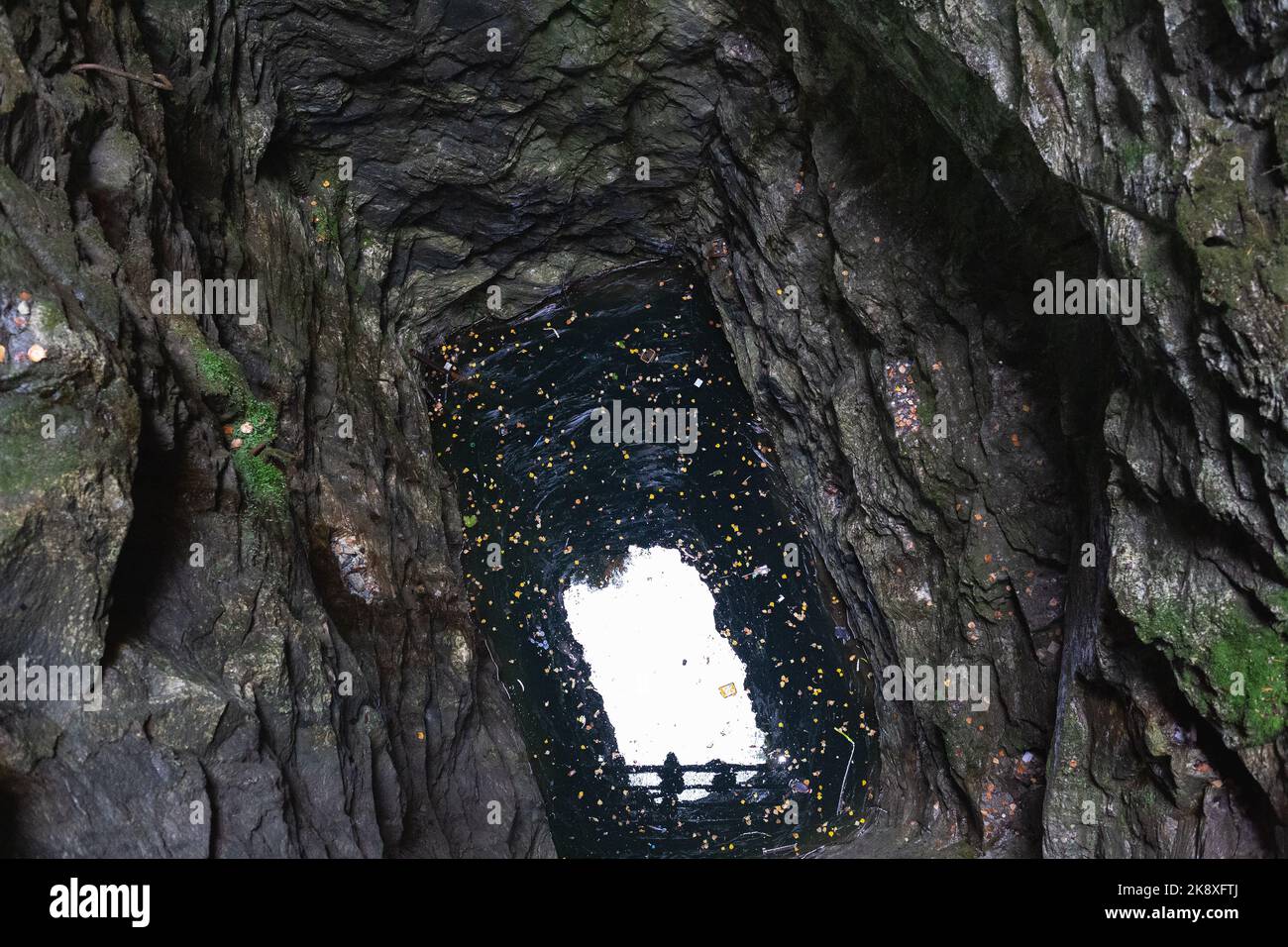 view of the sky through a deep granite underground well Stock Photo - Alamy