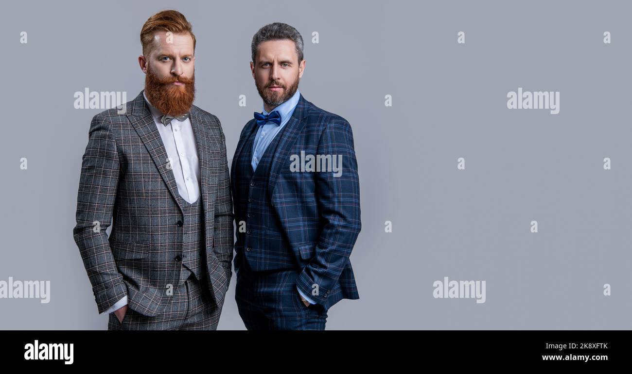 studio shot of men wearing tux with copy space. elegant men in formal ...