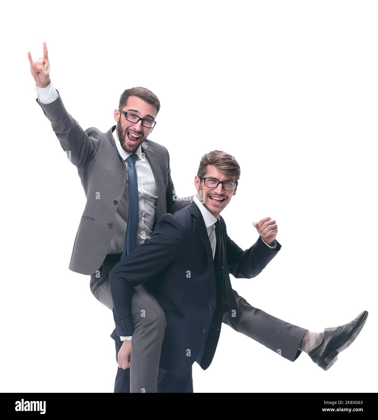 smiling businessman sitting on the back of his colleague Stock Photo ...