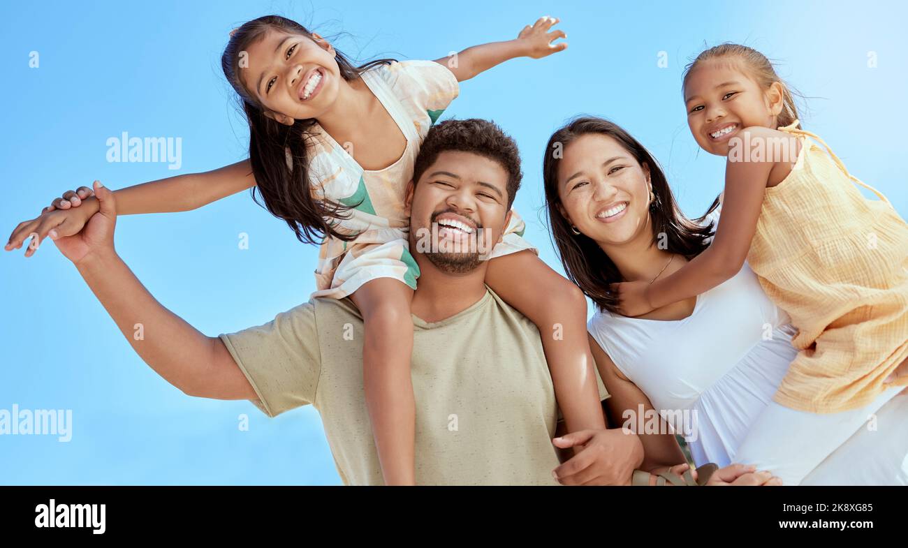 Happy family, couple with girl children and blue sky on outdoor summer ...