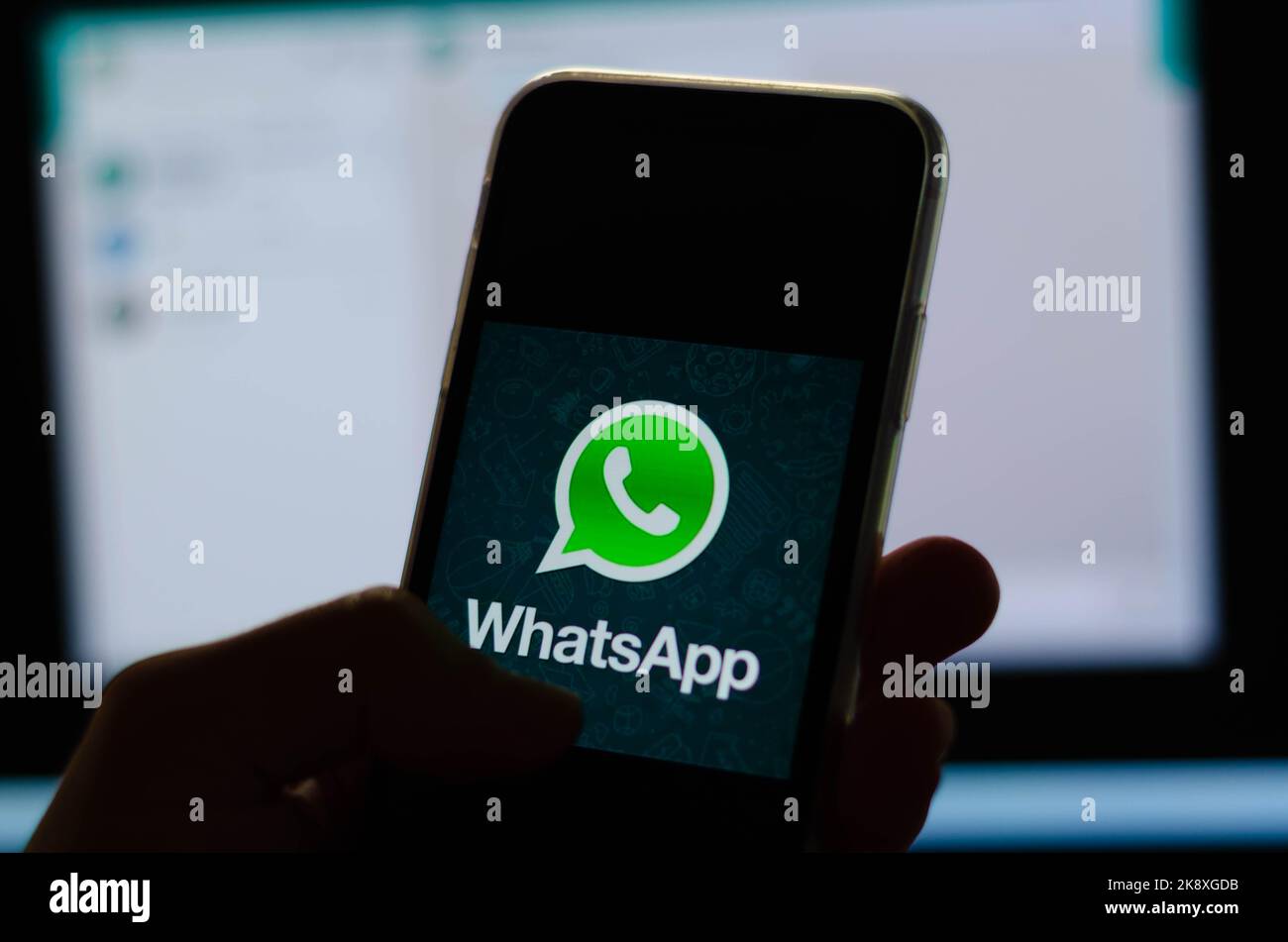 Hands Holding Mobile Smart Phone Device With Whatsapp Company App Logo ...