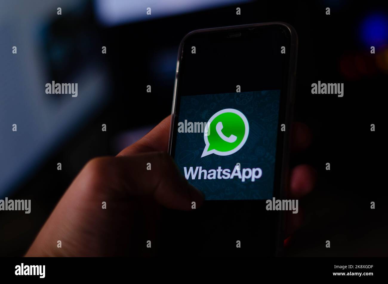 Hands Holding Mobile Smart Phone Device With Whatsapp Company App Logo ...