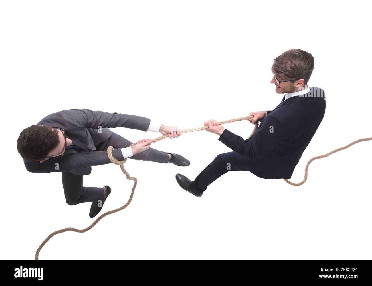 top view. two young businessmen pulling the rope Stock Photo - Alamy