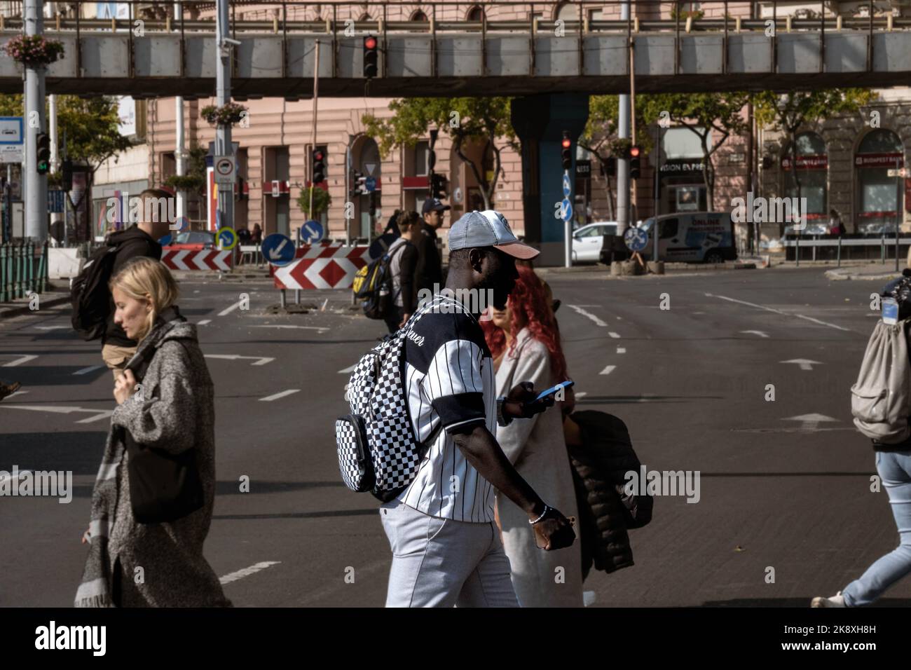 The street photography of Budapest's inner city with people crossing ...