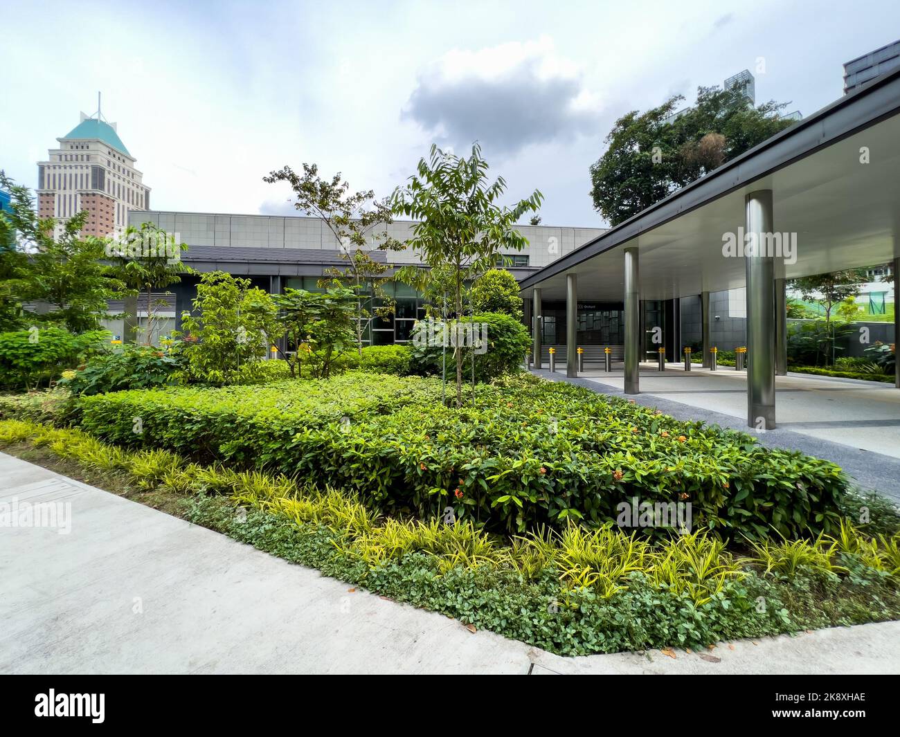 Beautiful landscaping greenery design along the public walkway ...