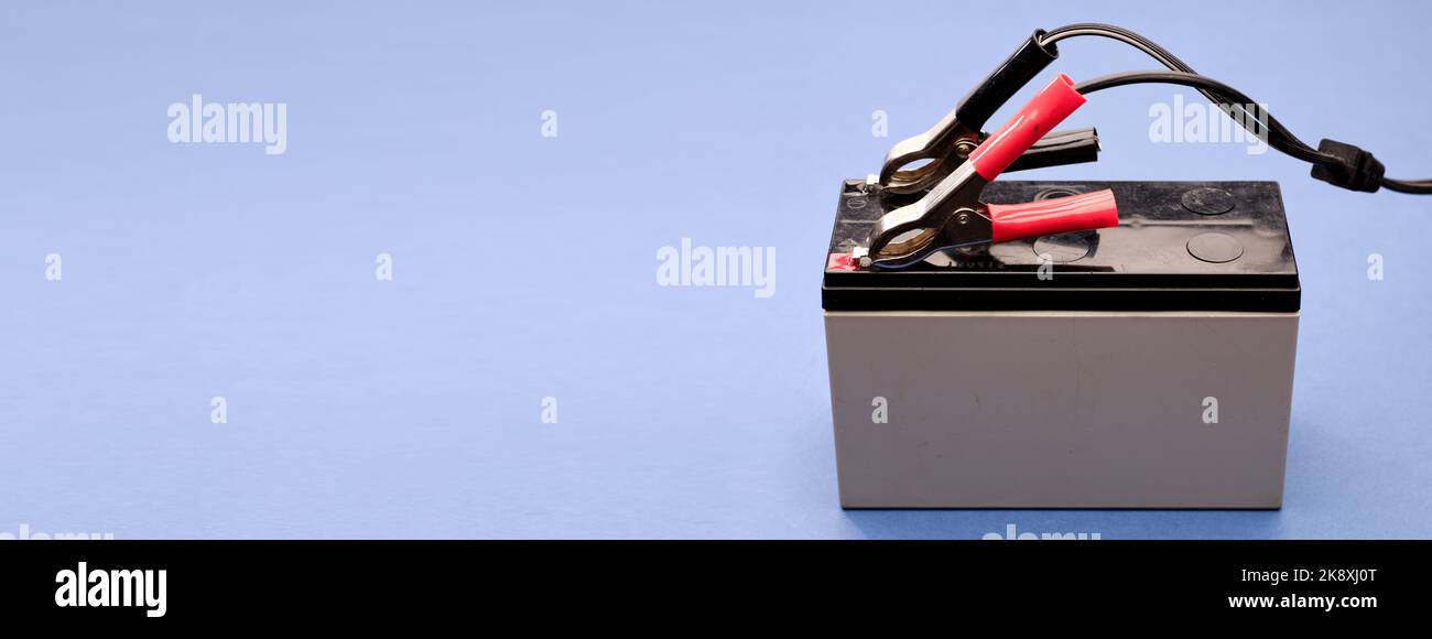 connected bolts charging positive pole and negative pole of battery ...