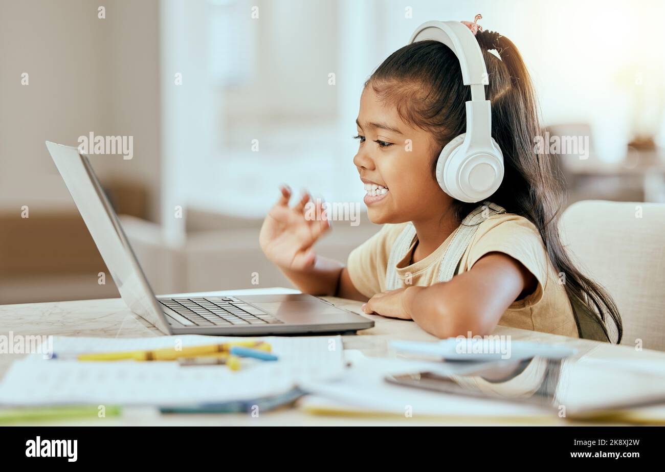 Video call, online education and child with laptop, headphones and home ...