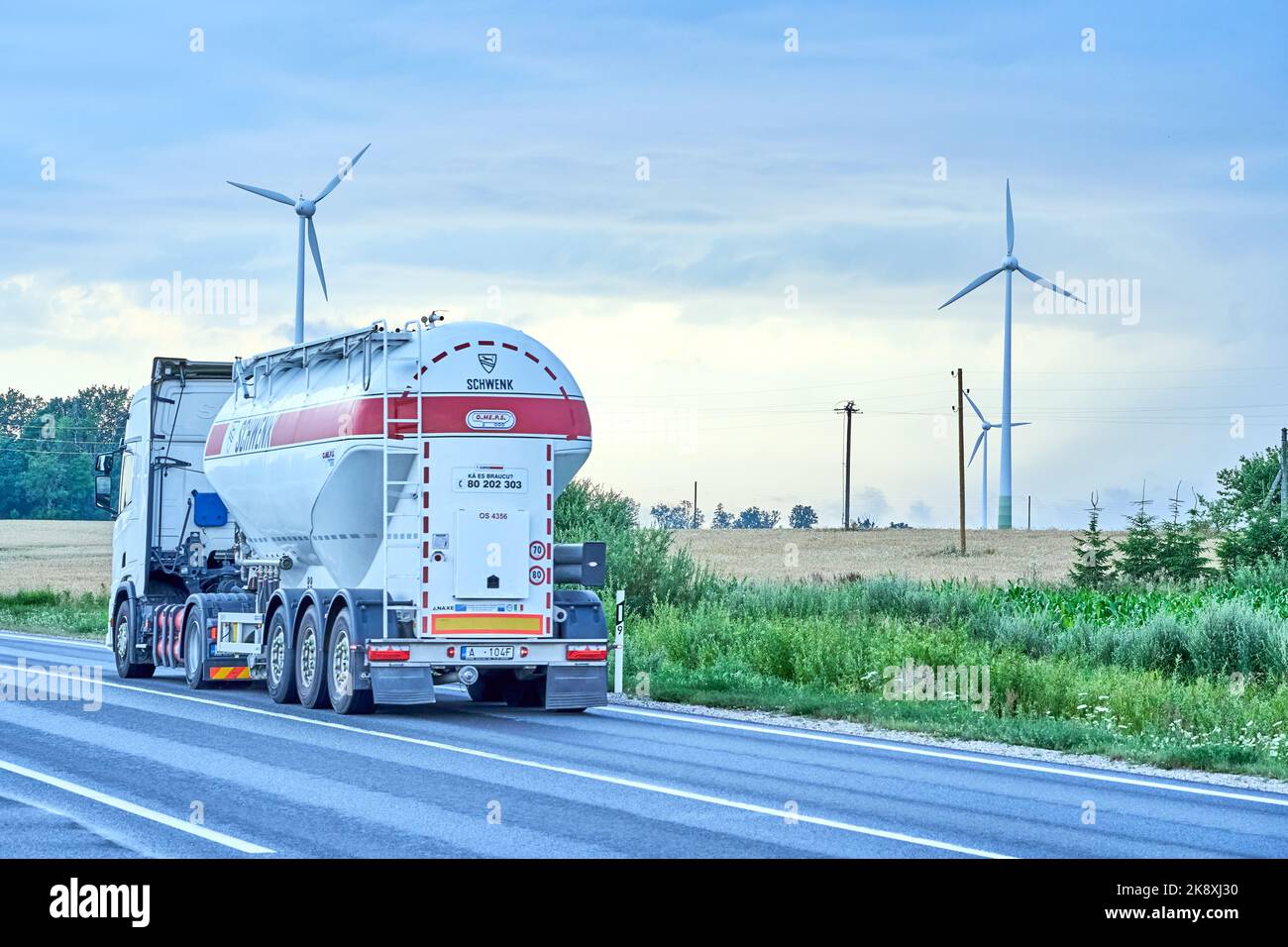 A modern heavy truck moving on the highway Stock Photo - Alamy