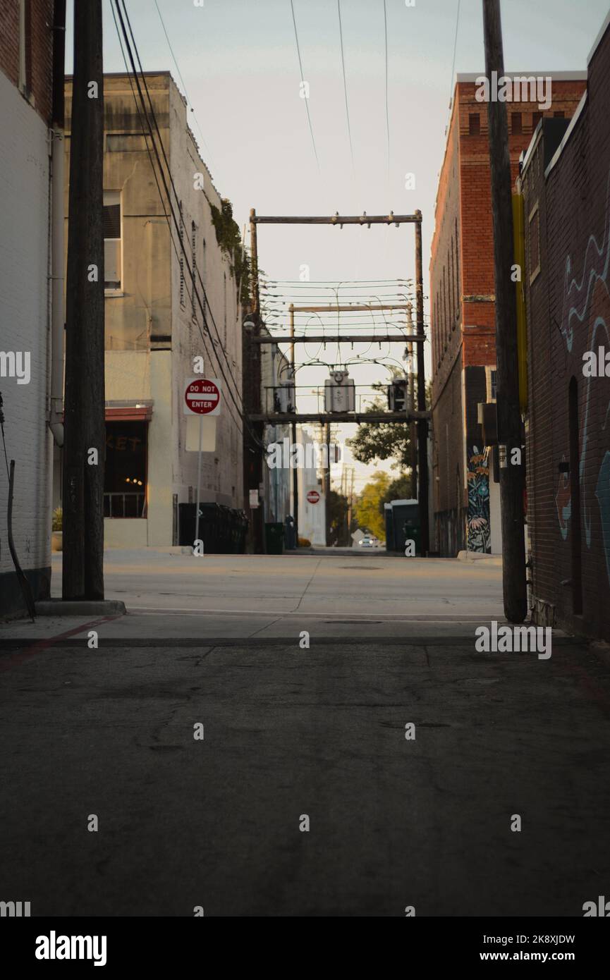 A vertical shot of an empty town alleyway Stock Photo - Alamy