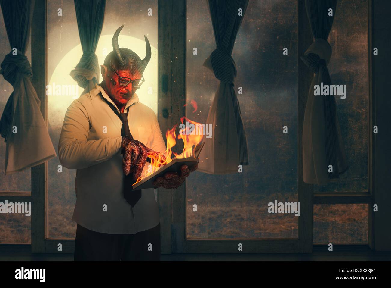 Devilman is standing and reading the book with fire in a haunted house ...
