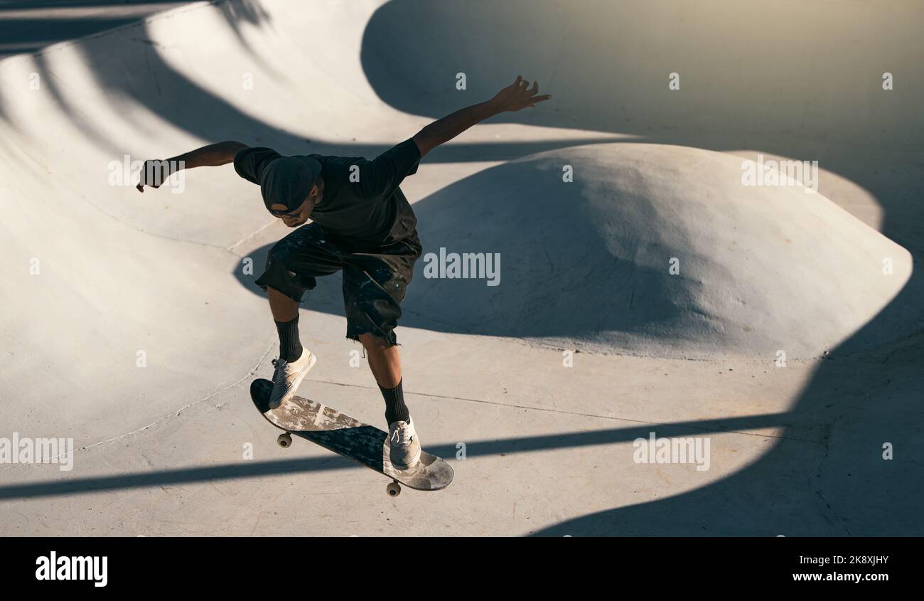 Man, skater and skateboard at park in air, trick or jump on ramp with ...