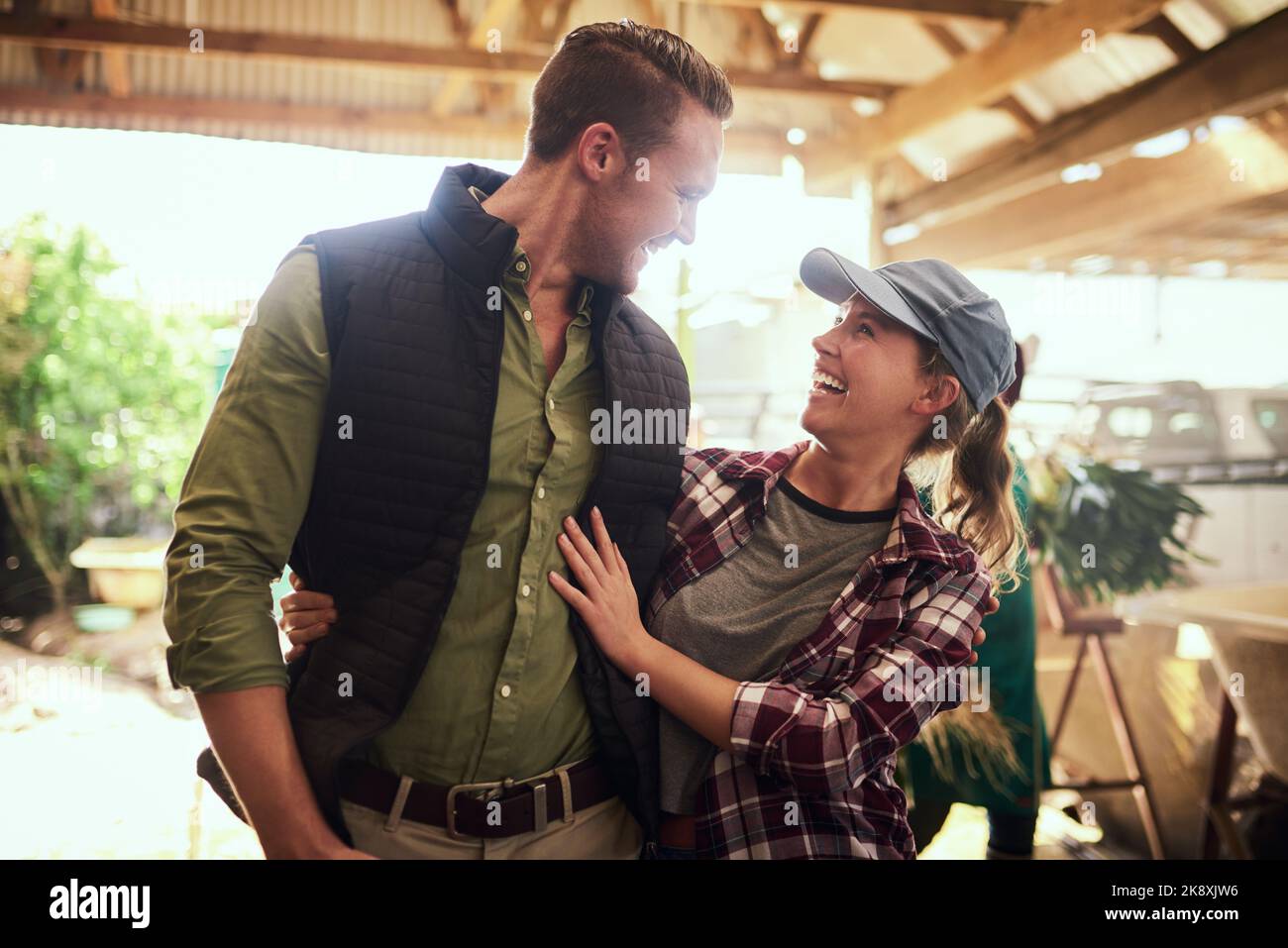Well grow old together on this farm. a happy young couple relaxing ...