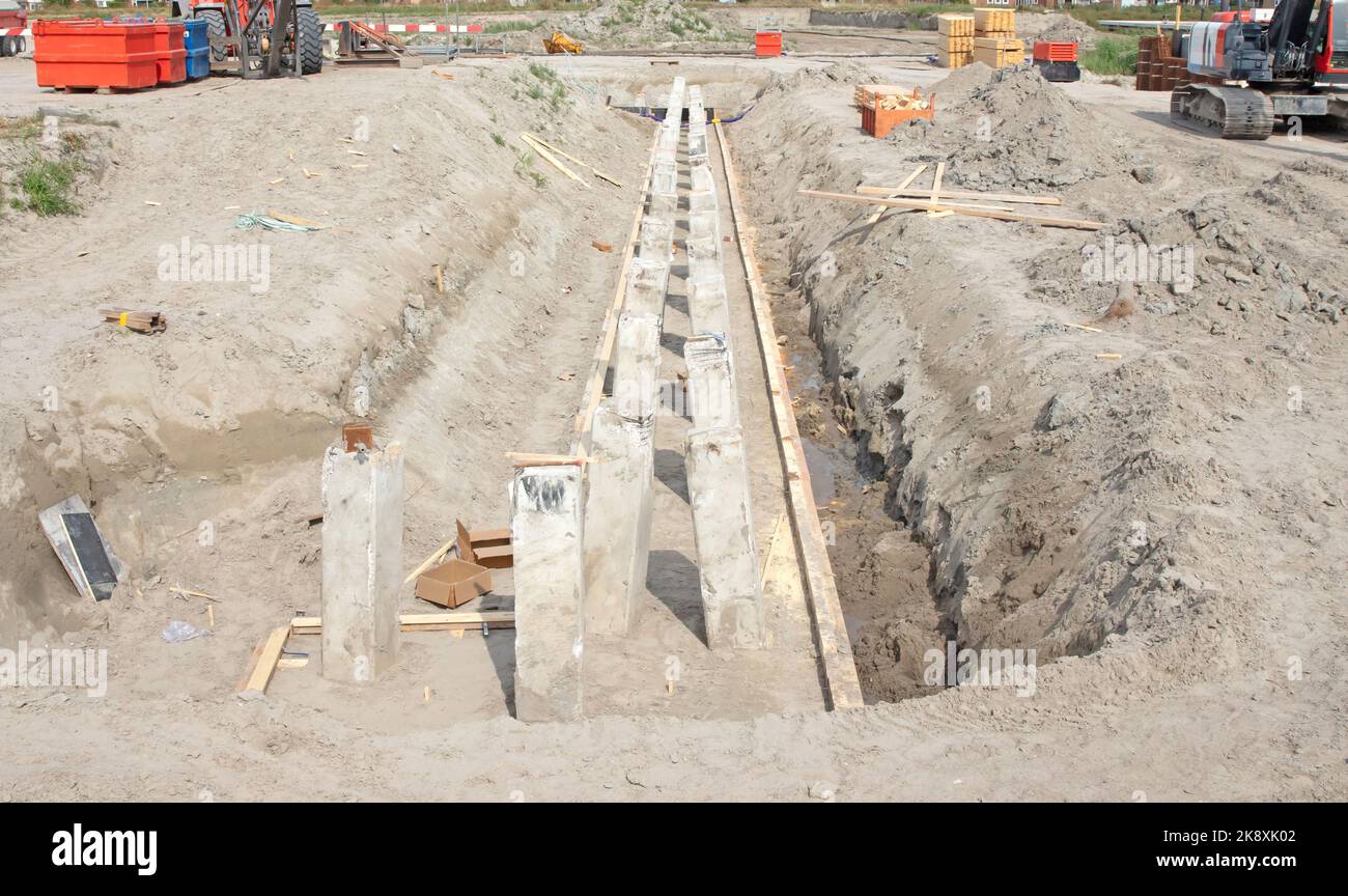 Concrete piles foundation for a new building on construction site ...