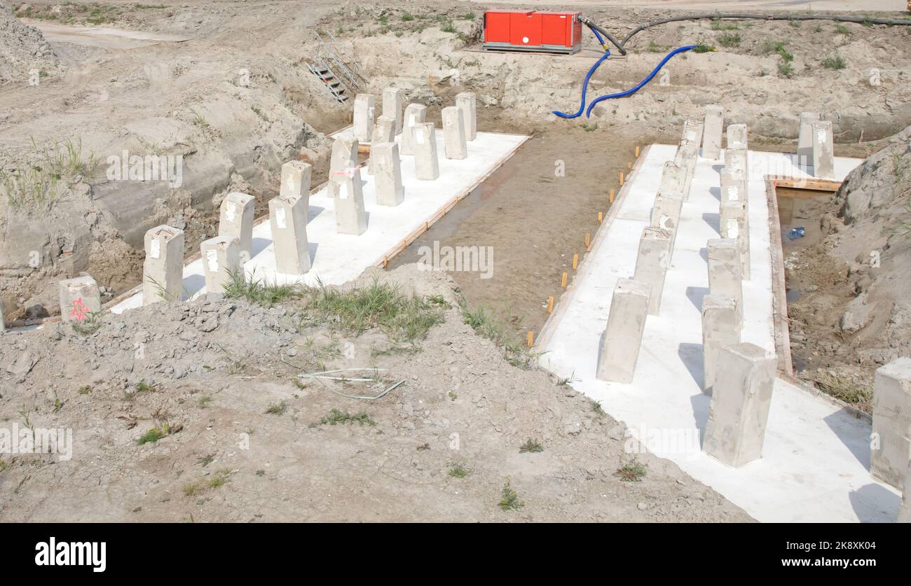 Concrete piles foundation for a new building on construction site ...