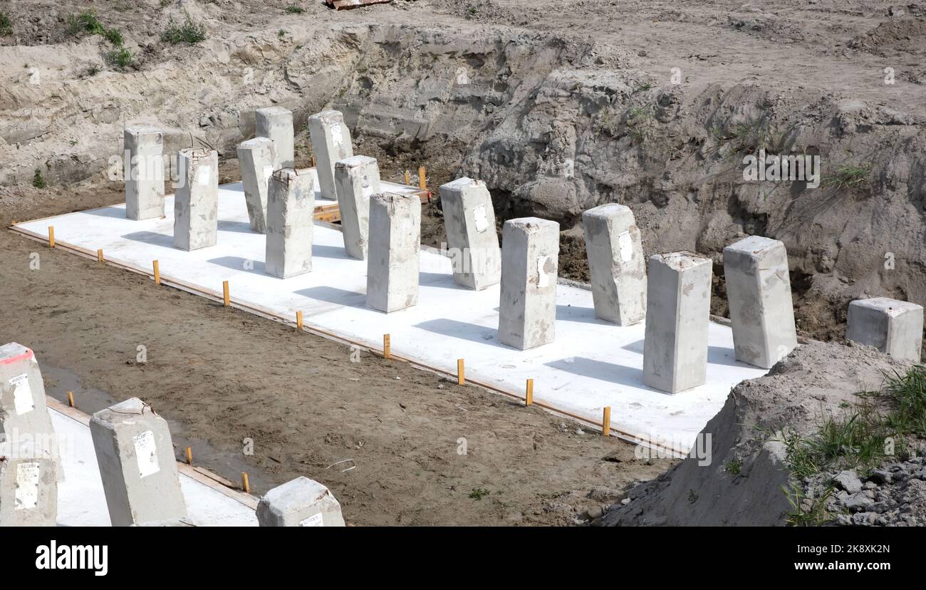 Concrete piles foundation for a new building on construction site ...