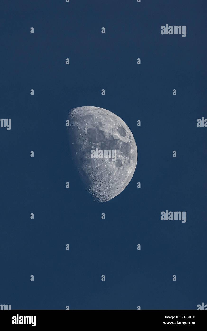 The Half Moon In the blue sky, vertical, background Stock Photo - Alamy