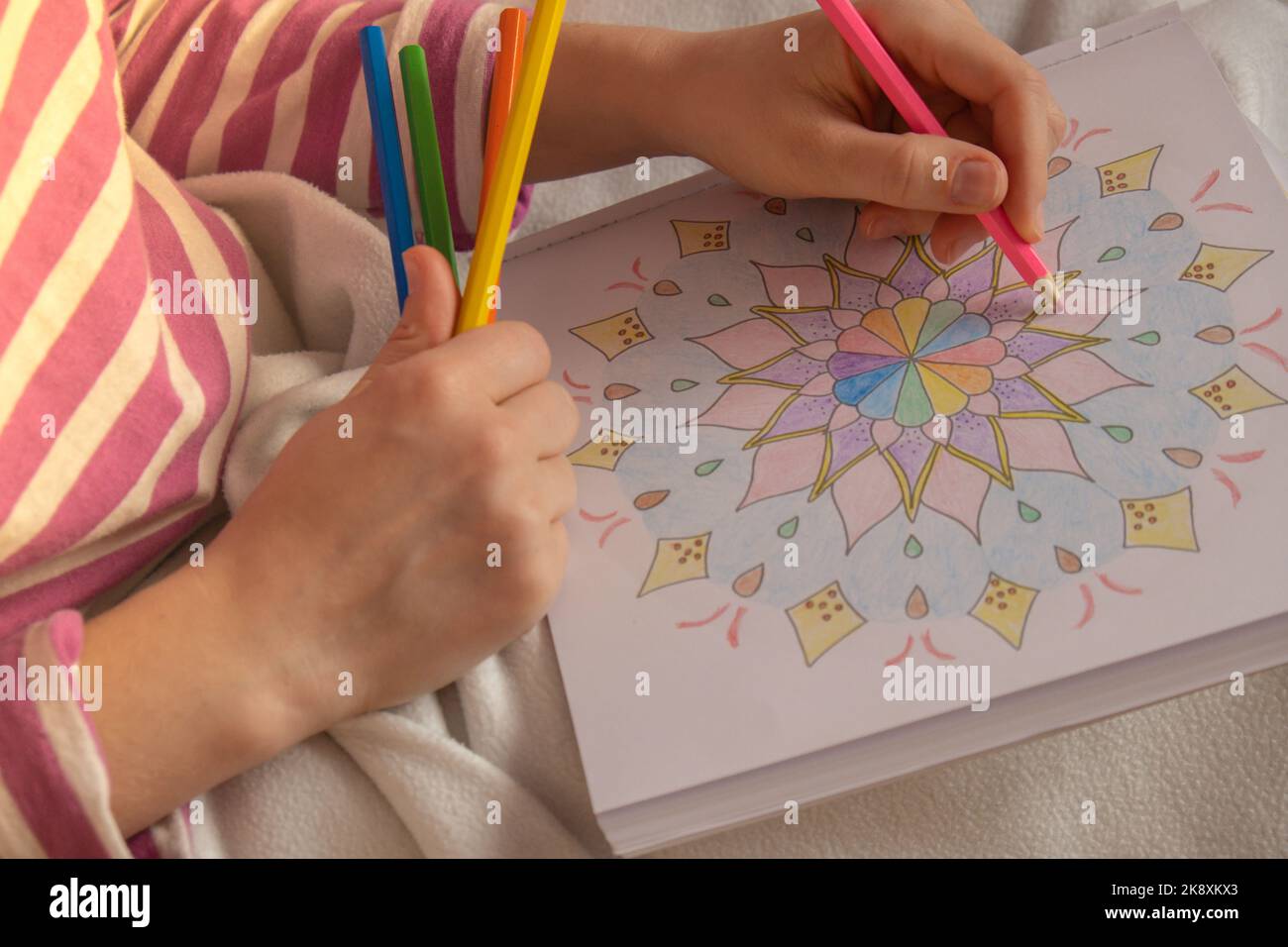 Woman coloring antistress page. Female hand painting mandala. Female ...