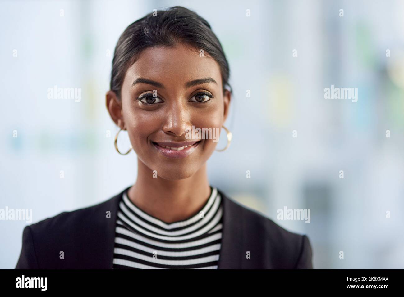 Success is yours to achieve. Portrait of an attractive young ...