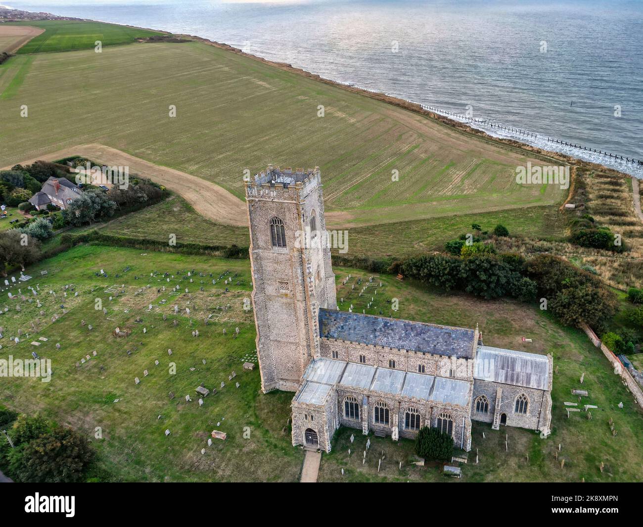 An aerial shot of a medieval building in Happisburgh village, on a ...