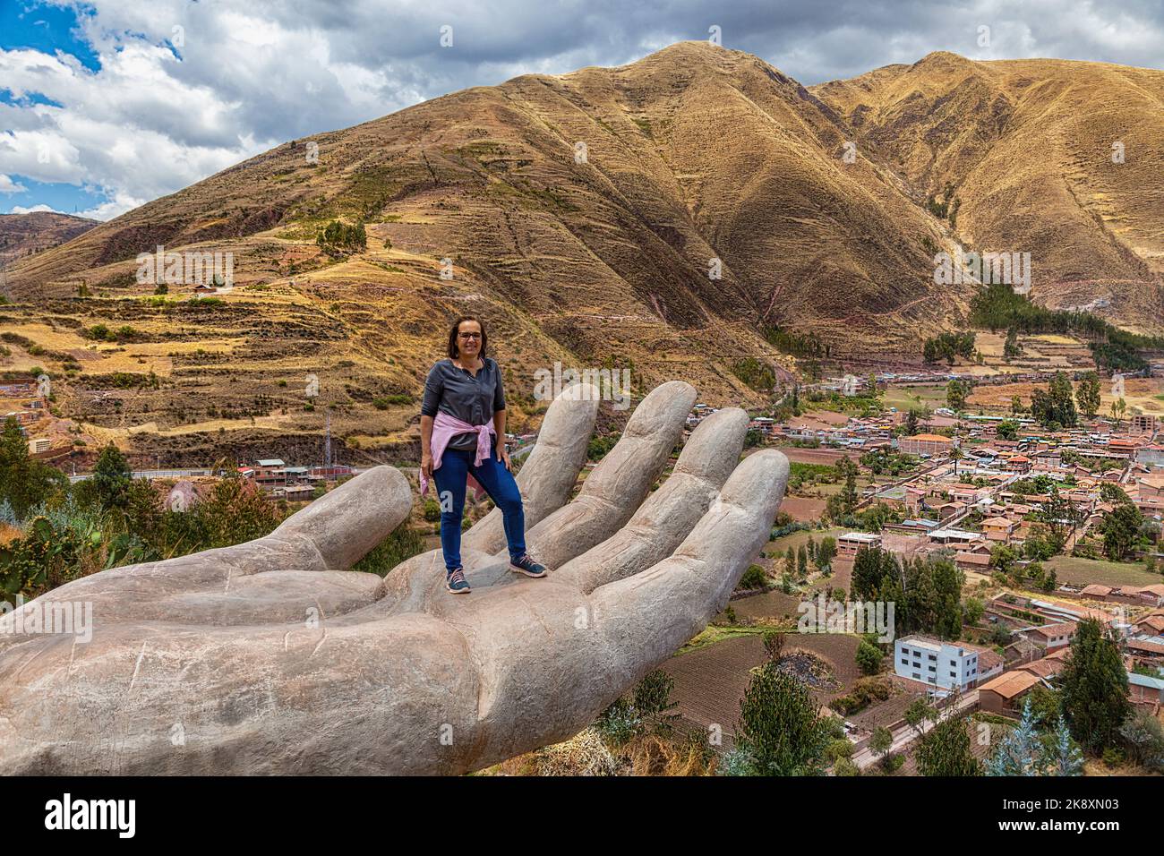 A woman at the Mirador de Cielo Punku viewpoint in Huaro, Cusco, Peru ...