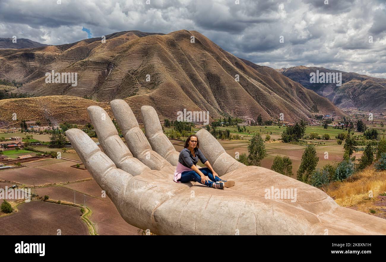A woman at the Mirador de Cielo Punku viewpoint in Huaro, Cusco, Peru ...