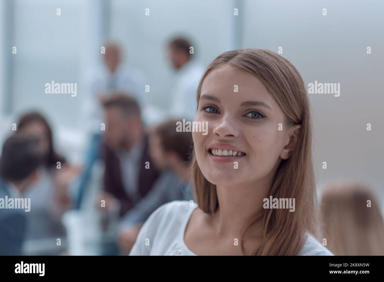 portrait of a successful young woman on the background of the office ...