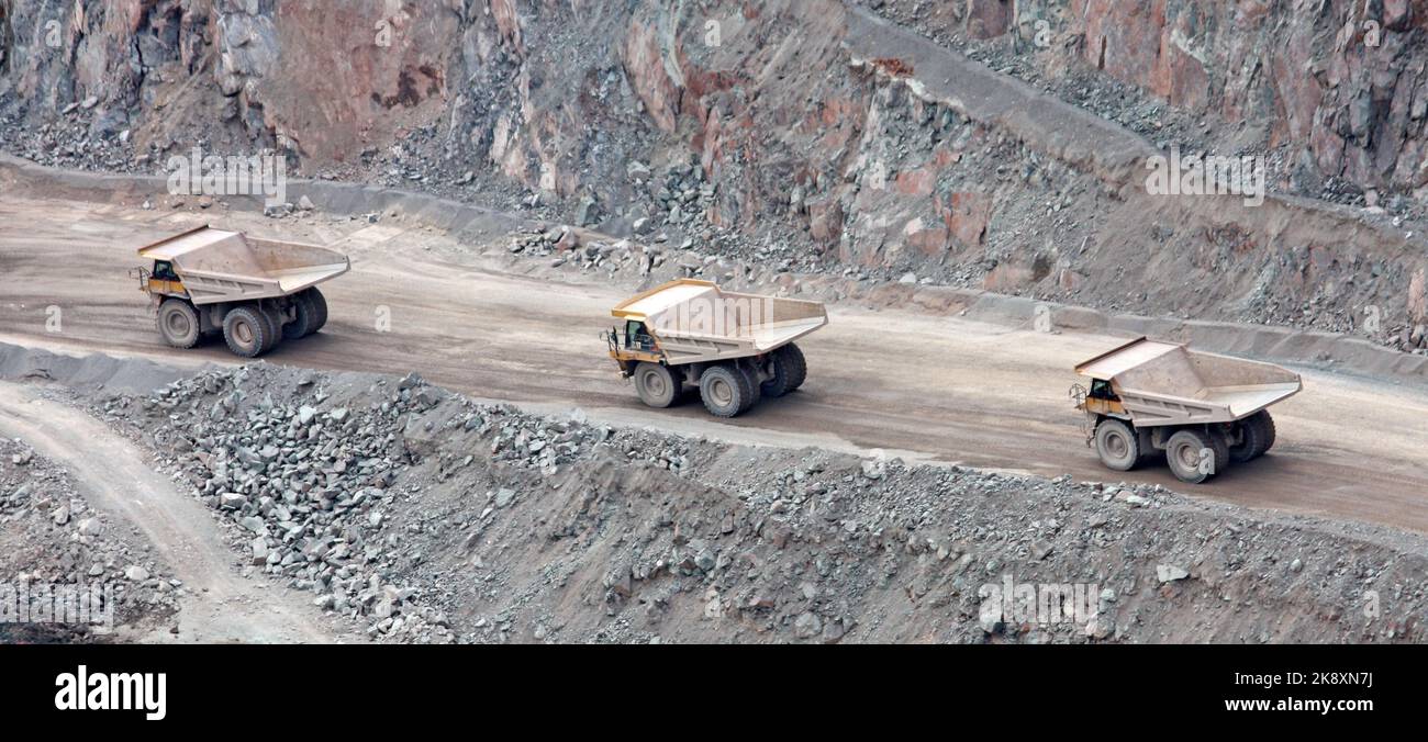 Three Large Lorry Trucks in a Granite Quarry Stock Photo - Alamy