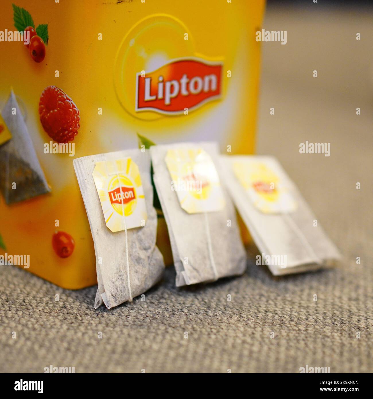 A closeup of Lipton brand black tea in bags and a yellow box Stock ...
