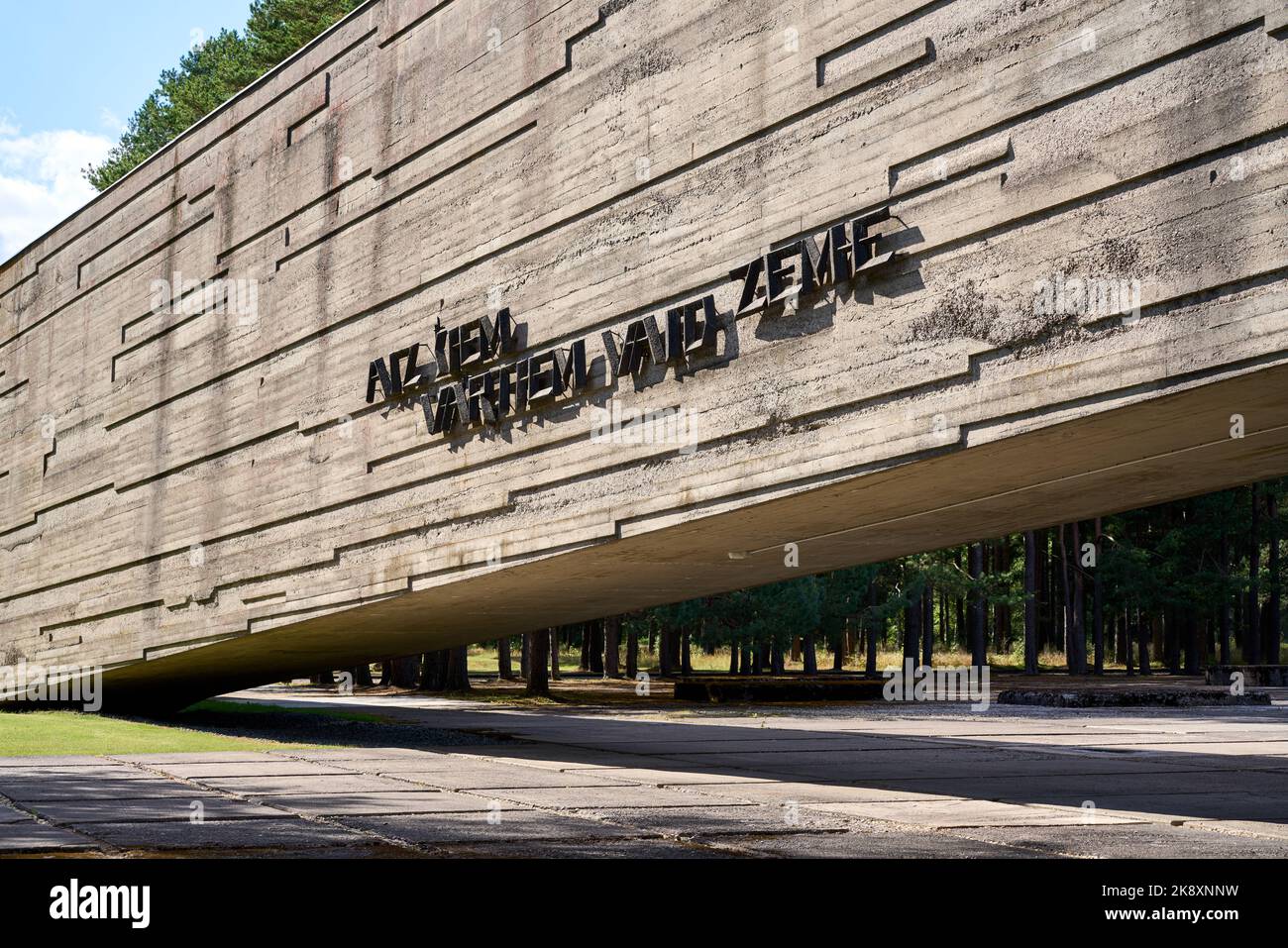 A stone board with text in Salaspils memorials of somber Nazi prison ...