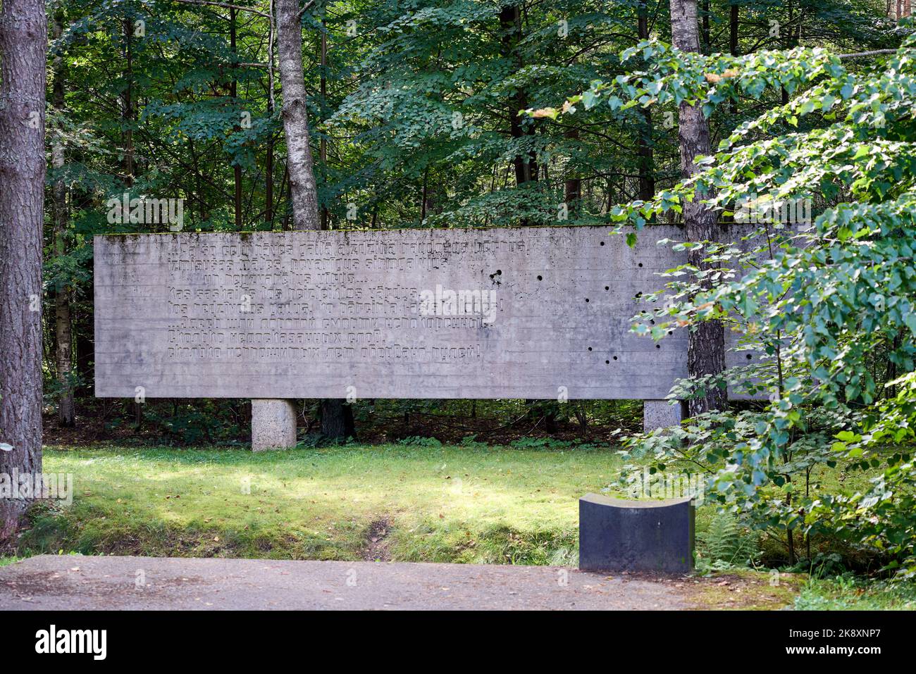 A concrete board with text in Salaspils memorials of somber Nazi prison ...