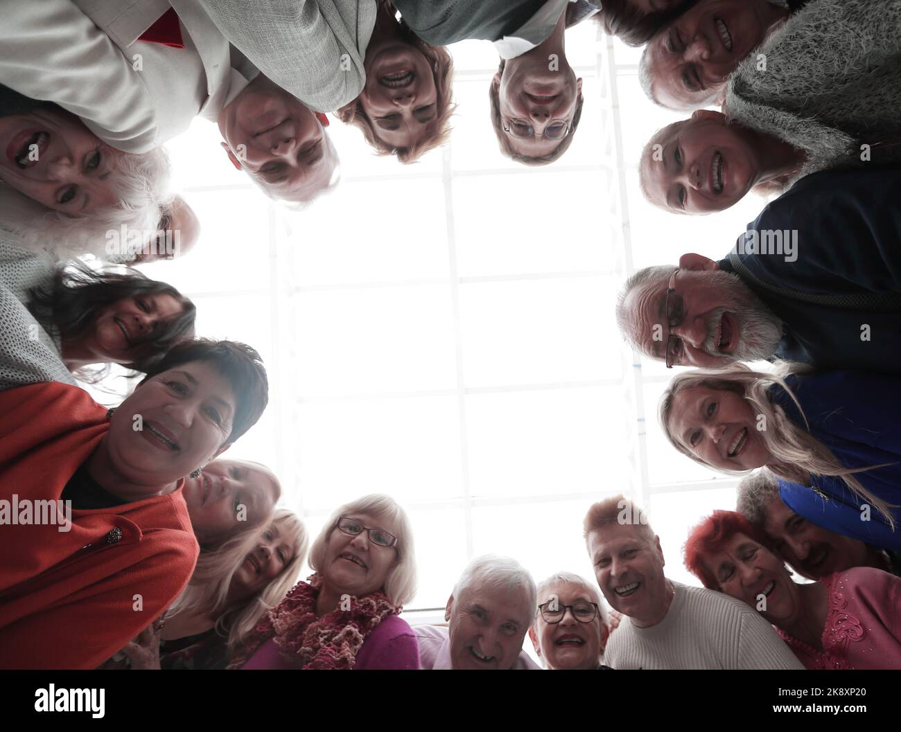 Happy people looking down at camera Stock Photo - Alamy