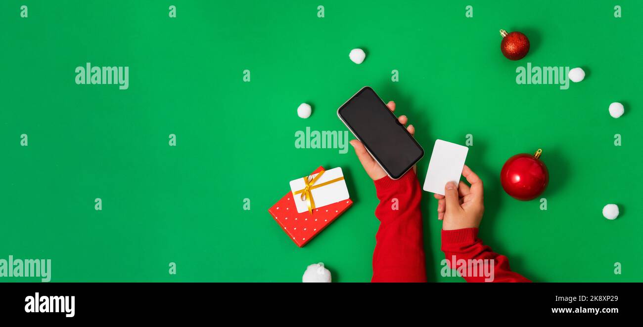 Minimal flat lay online payment for Christmas gifts with bank card from ...