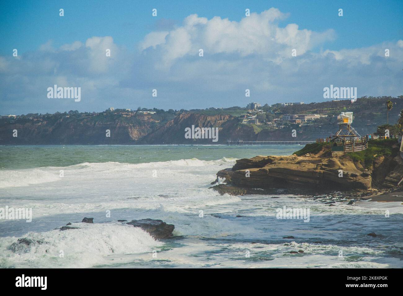 A scenic view of a cove with a beach full of cliffs in La Jolla, San ...