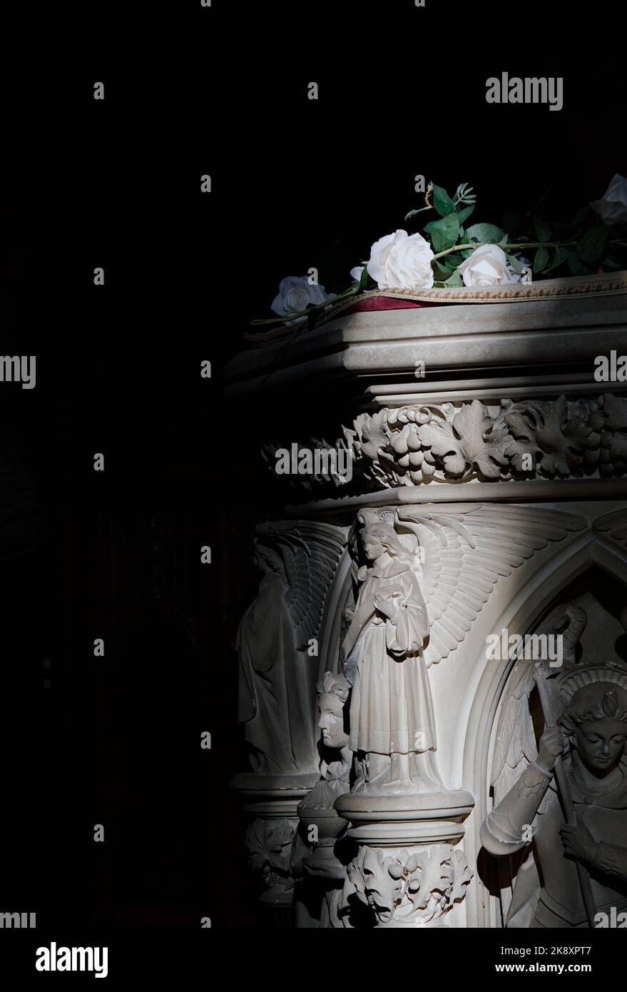 Carved Stone Pulpit Lit By A Ray Of Light With White Roses On Top ...