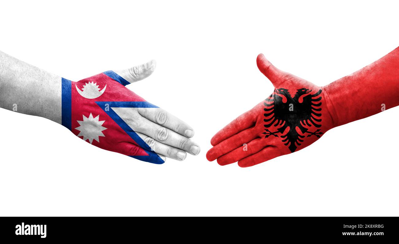 Handshake between Albania and Nepal flags painted on hands, isolated ...