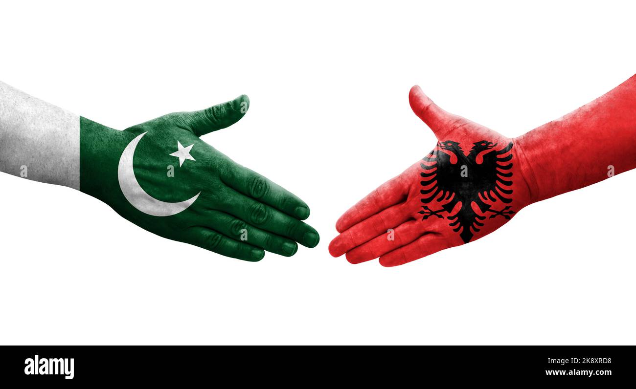 Handshake between Albania and Pakistan flags painted on hands, isolated ...