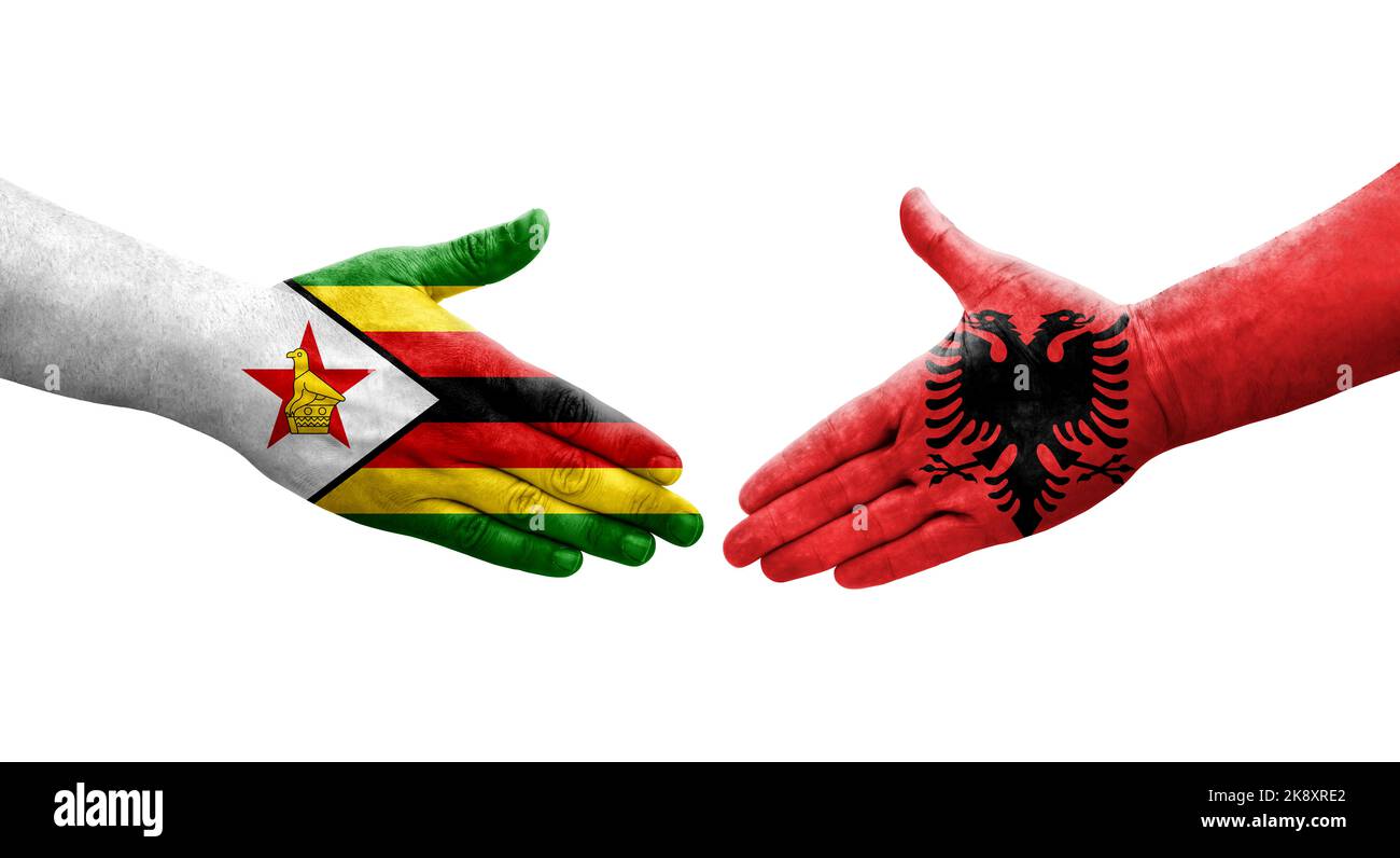 Handshake between Albania and Zimbabwe flags painted on hands, isolated ...