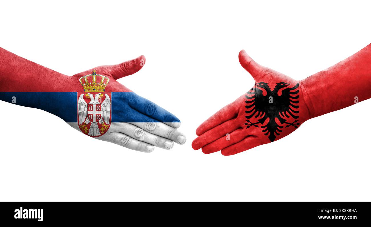 Handshake between Albania and Serbia flags painted on hands, isolated ...