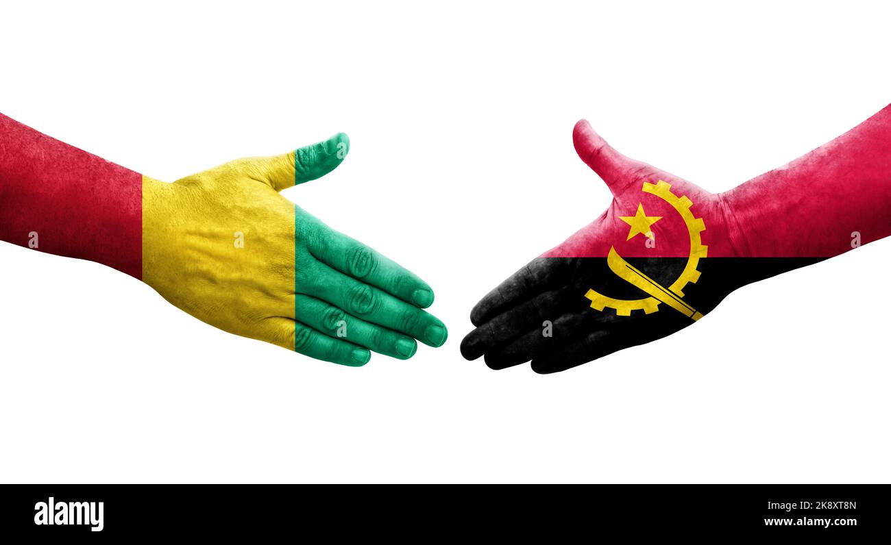 Handshake between Angola and Guinea flags painted on hands, isolated ...