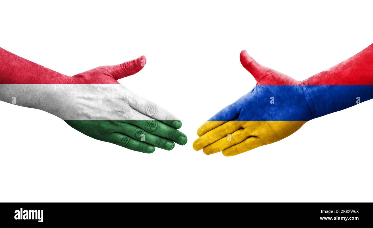 Handshake between Armenia and Hungary flags painted on hands, isolated ...