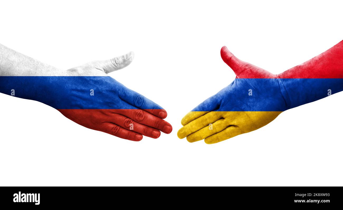 Handshake between Armenia and Russia flags painted on hands, isolated ...
