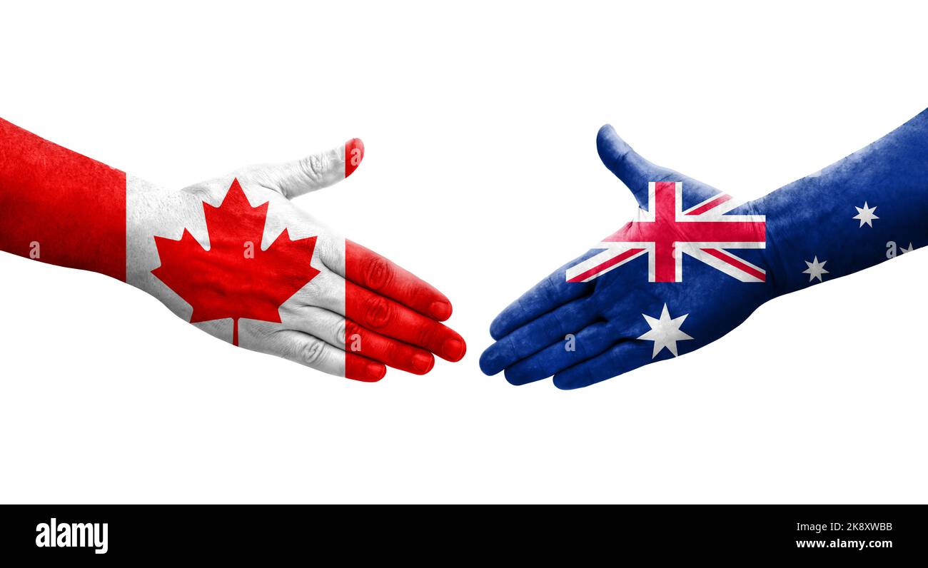 Handshake between Australia and Canada flags painted on hands, isolated ...