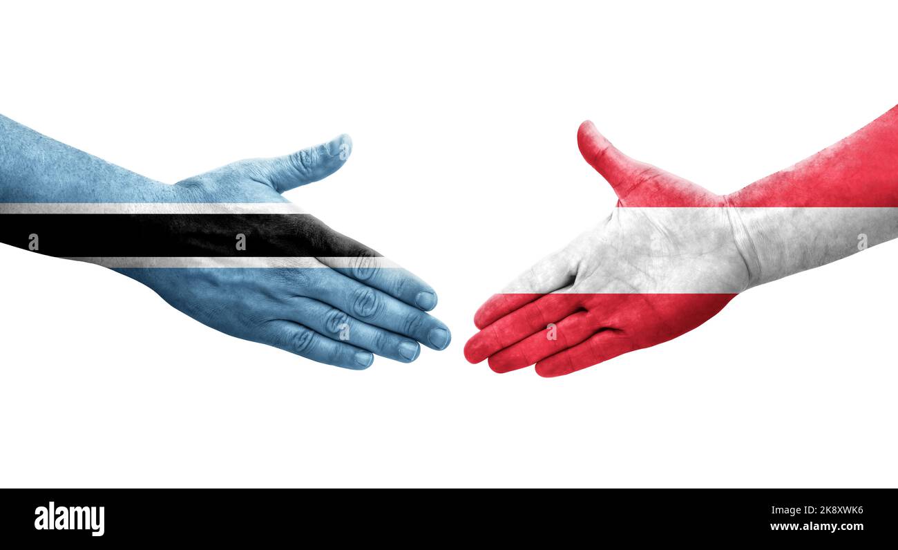 Handshake between Austria and Botswana flags painted on hands, isolated ...