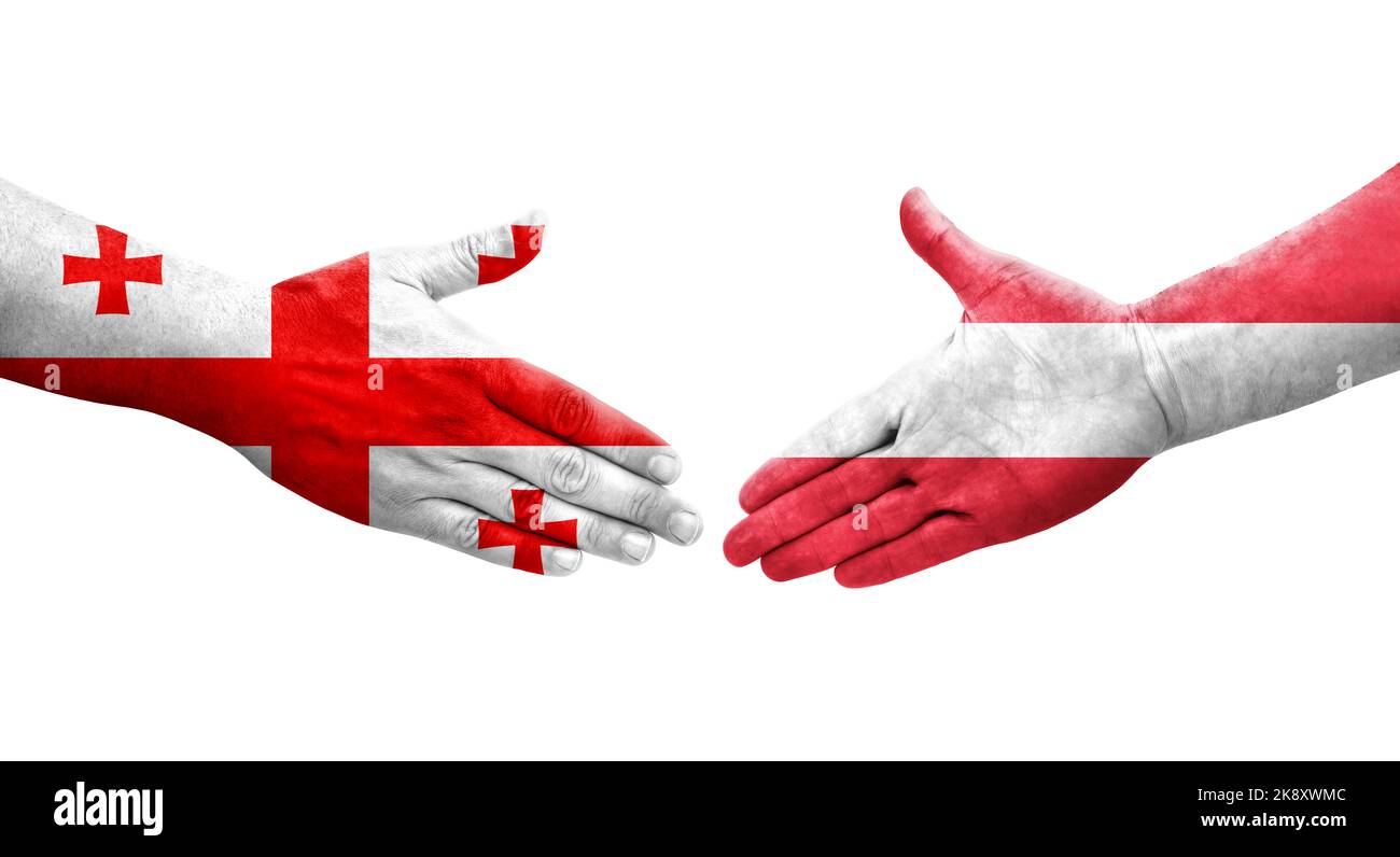 Handshake between Austria and Georgia flags painted on hands, isolated ...