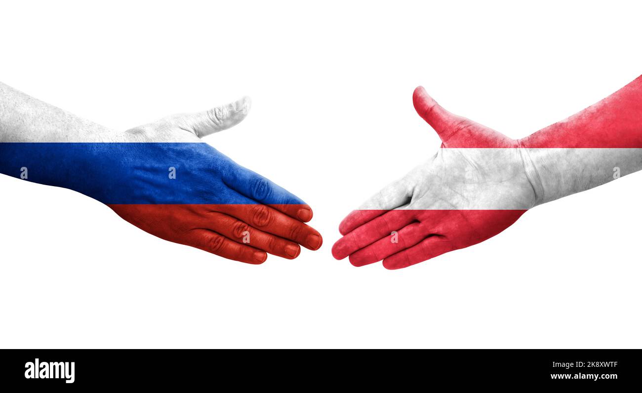 Handshake between Austria and Russia flags painted on hands, isolated ...
