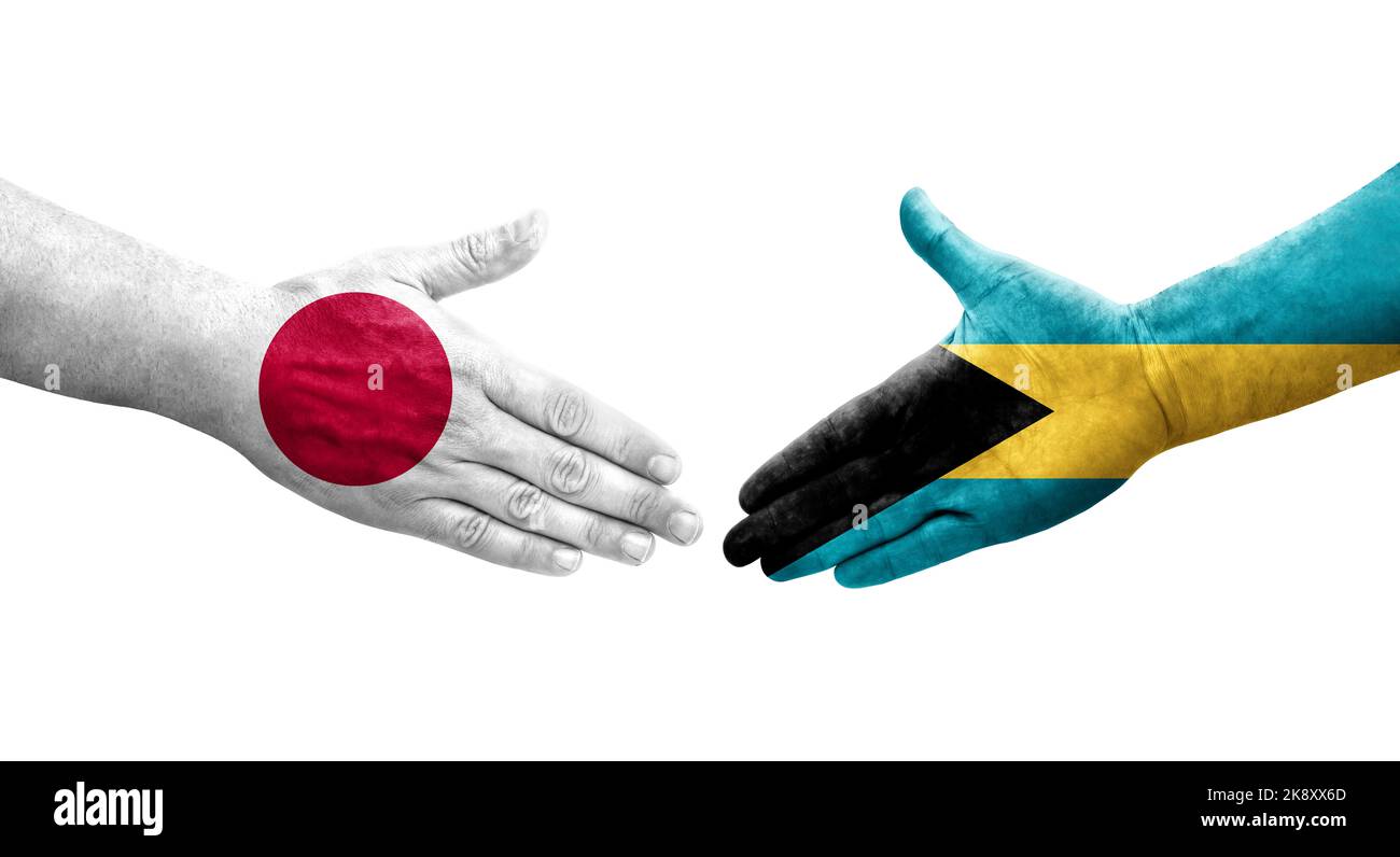 Handshake between Bahamas and Japan flags painted on hands, isolated ...